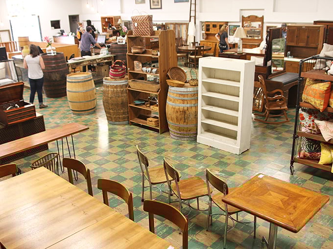 Wooden barrels and vintage tables create RERUN's signature aesthetic—part rustic farmhouse, part urban loft, all with more character than the entire IKEA catalog.