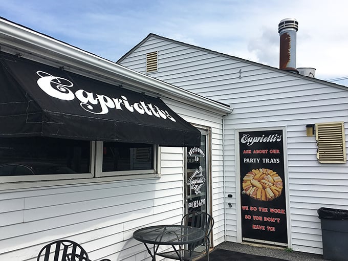 Capriotti's simple white exterior belies the sandwich revolution happening inside. That black awning shelters turkey sandwich perfection!
