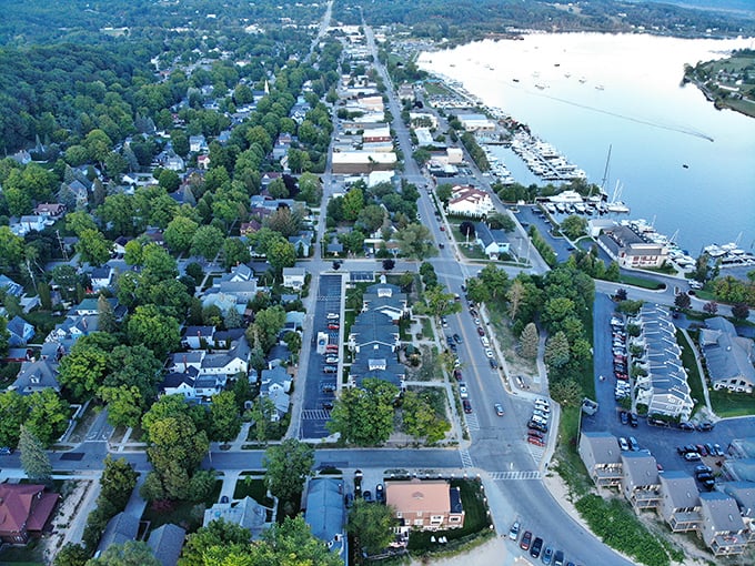 Frankfort: Aerial autumn glory showcases Frankfort's perfect position between colorful forests and Lake Michigan's endless blue.