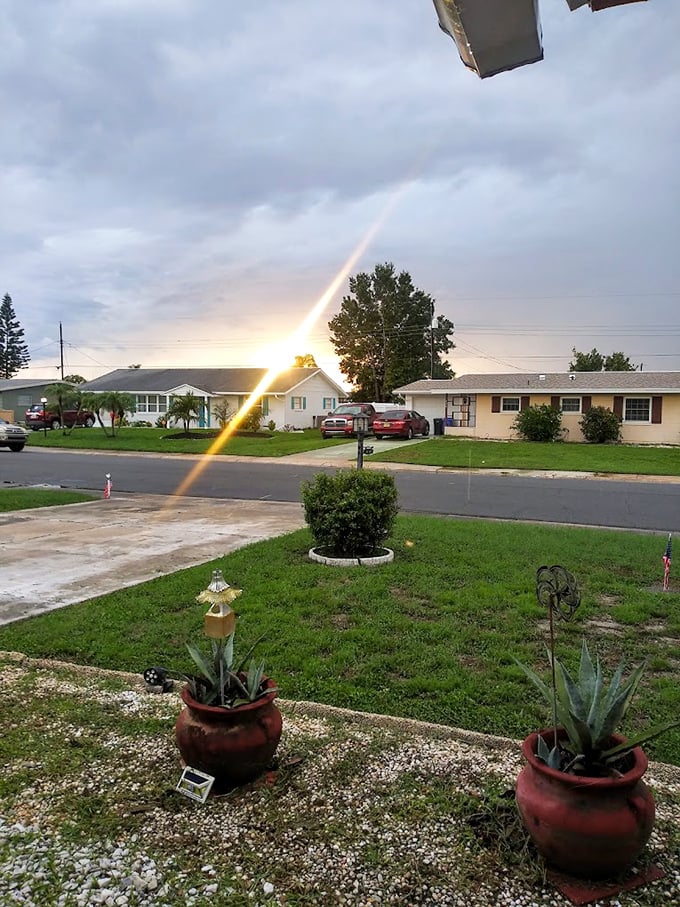 Kings Point's sunset casts a golden glow over modest homes where neighbors become family and golf carts become the transportation of choice.