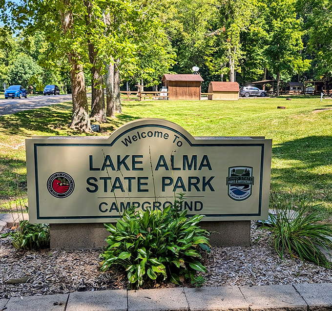 Lake Alma welcomes visitors with a sign that promises adventure beyond. The gateway to your next favorite memory!