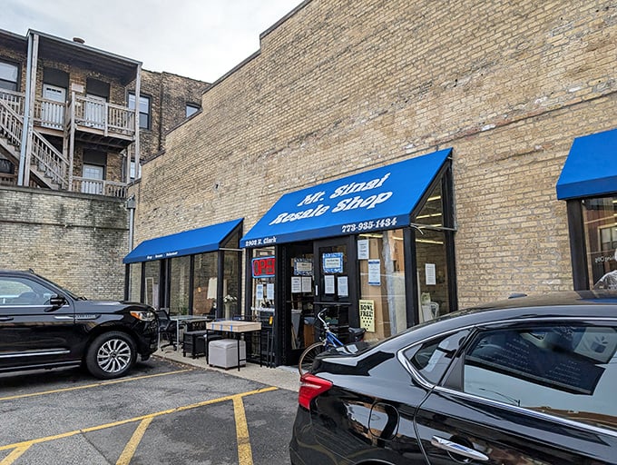 The classic blue awning and simple storefront promise no-nonsense shopping for practical treasure hunters seeking value.