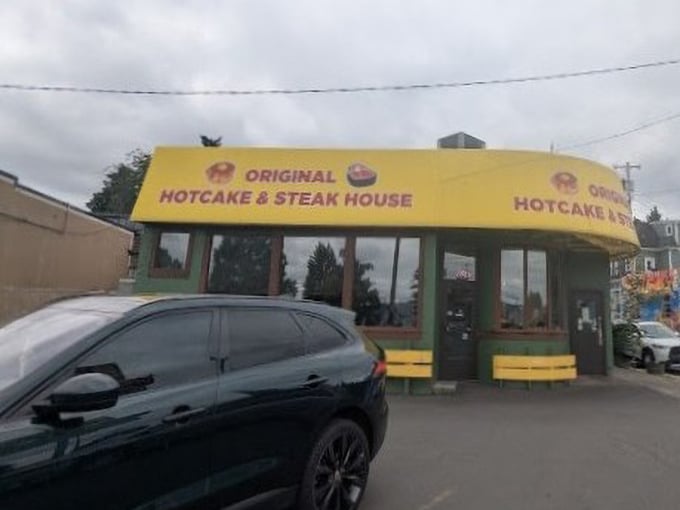 The unmistakable yellow awning of Original Hotcake House – where pancakes are served 24/7 and night owls meet early birds.
