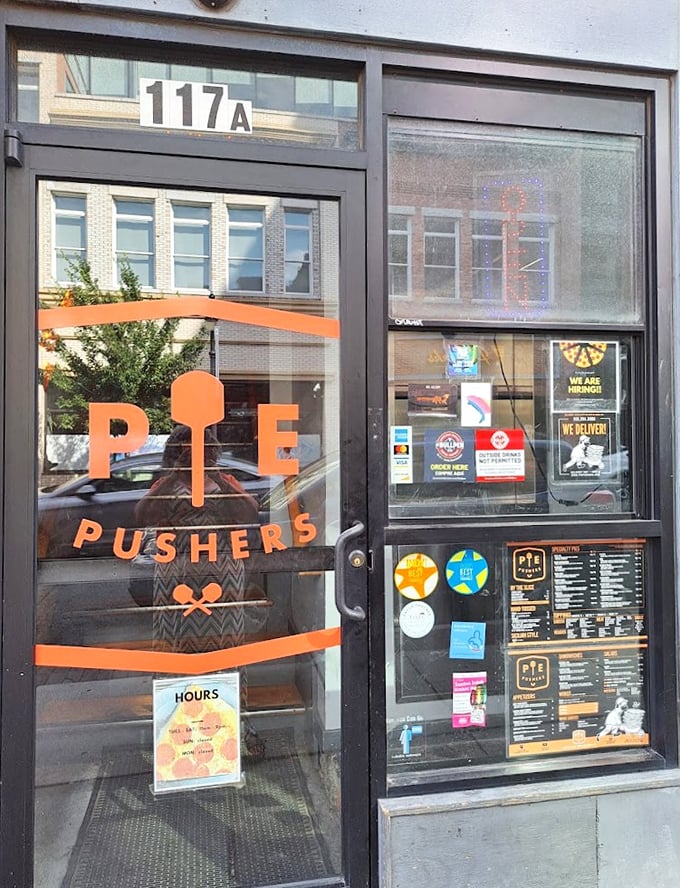That bold orange "PIE PUSHERS" logo isn't just a name—it's a mission statement. These folks are determined to elevate your pizza experience.