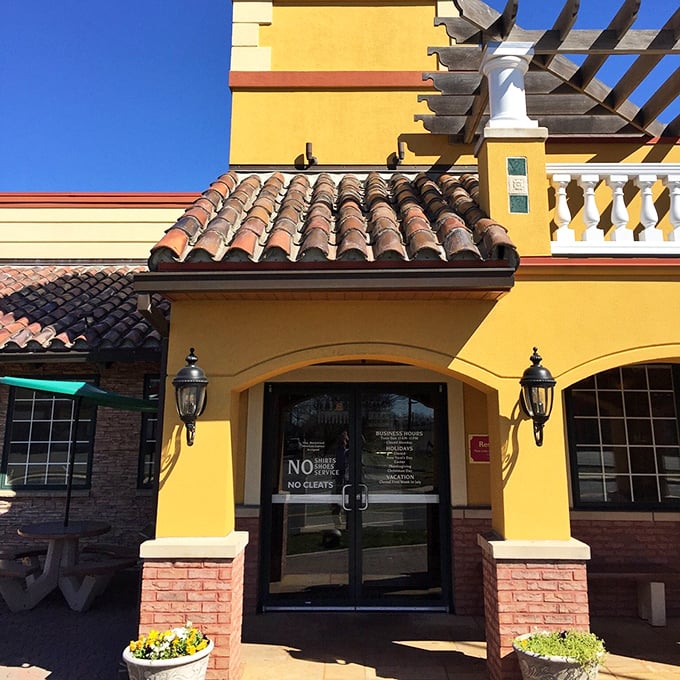 Pizza John's sunny yellow exterior stands out like a pizza paradise oasis, promising comfort food memories in the making. 