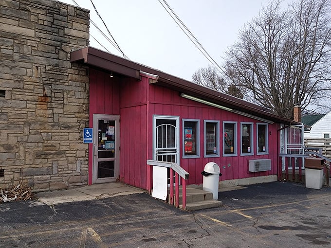 Porky's rustic stone wall and burgundy siding combo is the architectural equivalent of comfort food – unpretentious and completely satisfying.