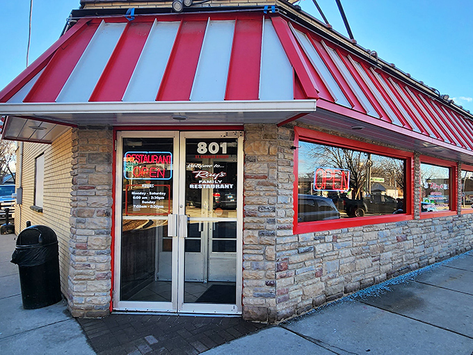 Ray's Family Restaurant's distinctive red and white awning pops against its stone exterior. A breakfast fortress ready to defend against hunger.