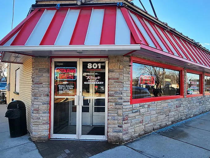 Ray's Family Restaurant's distinctive red and white awning pops against its stone exterior. A breakfast fortress ready to defend against hunger.