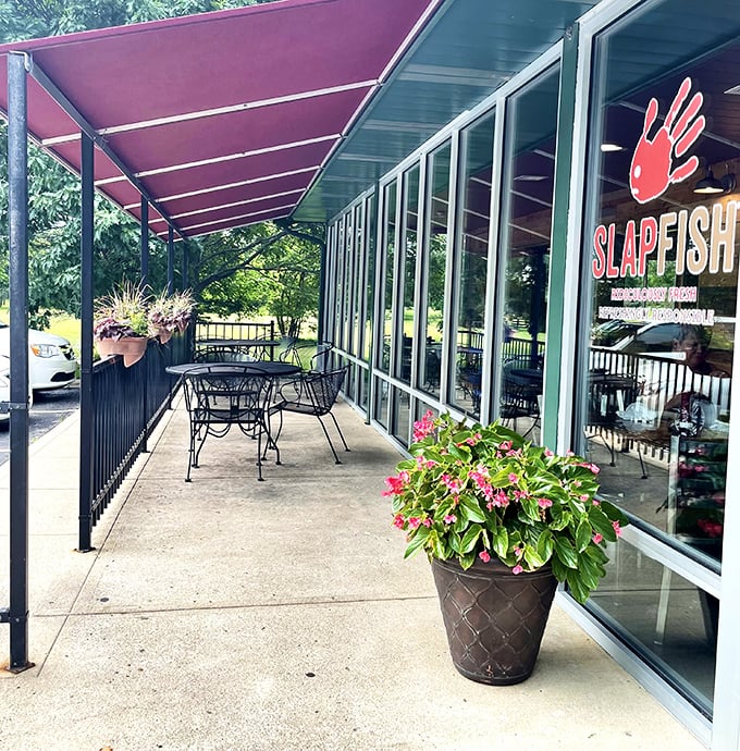 Slapfish's cheerful patio invites you to linger over lobster rolls. Those pink flowers aren't just pretty – they're celebrating your good taste!