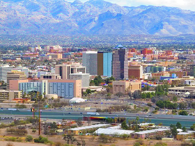 Tucson's skyline sits nestled against dramatic mountain backdrops—city convenience with nature's grandeur just a glance away.