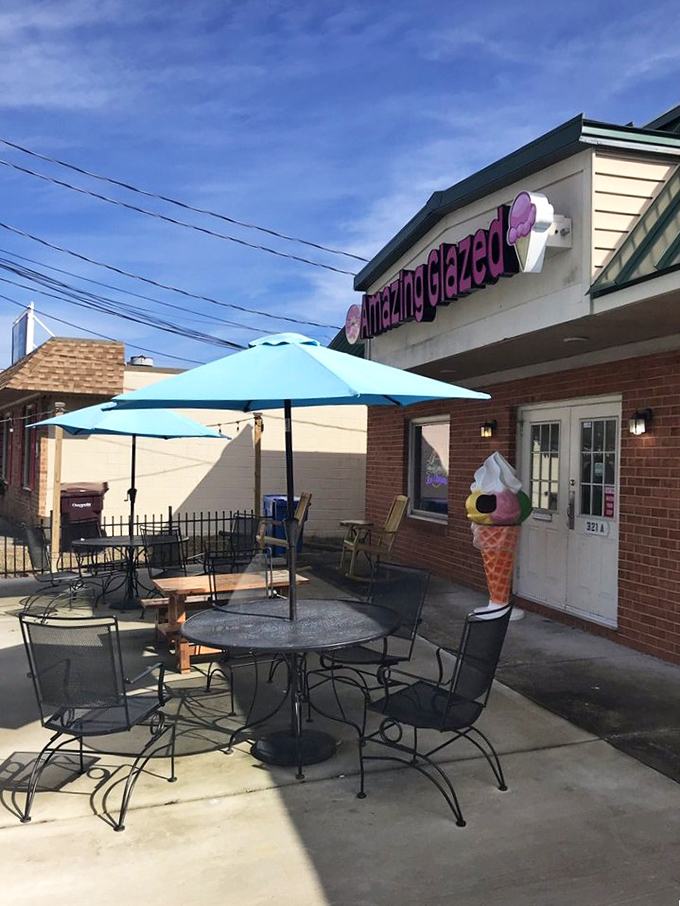 Those blue umbrellas aren't just for show – they're staging areas for donut enjoyment that lives up to the "amazing" promise.
