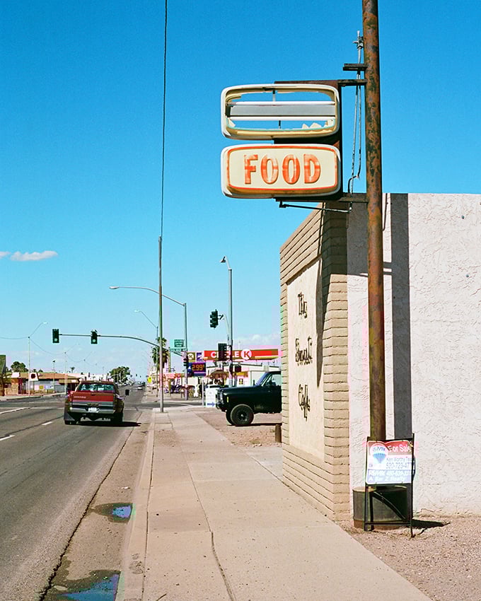 That vintage "FOOD" sign in Coolidge says it all—straightforward living where your retirement dollars buy more than just atmosphere.