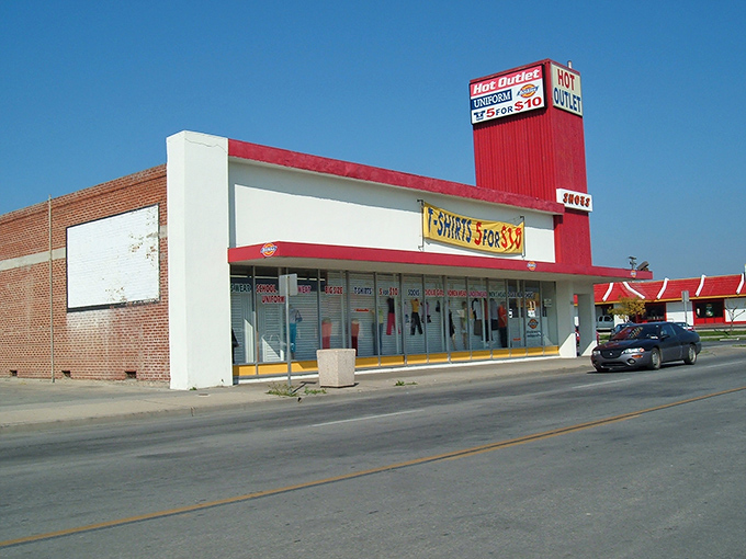 Delano's no-frills shopping district keeps things practical and affordable. That Hot Outlet sign promises bargains in Central Valley heat!