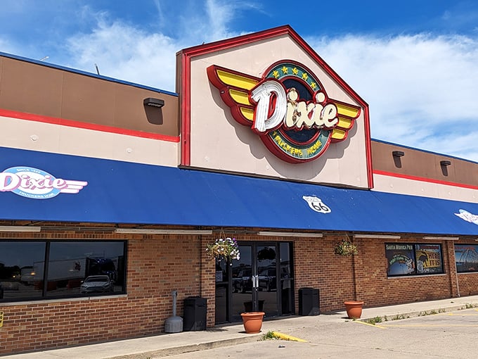The colorful Dixie sign promises comfort food that'll make you forget your troubles. Blue skies and fried chicken—what more could you want?