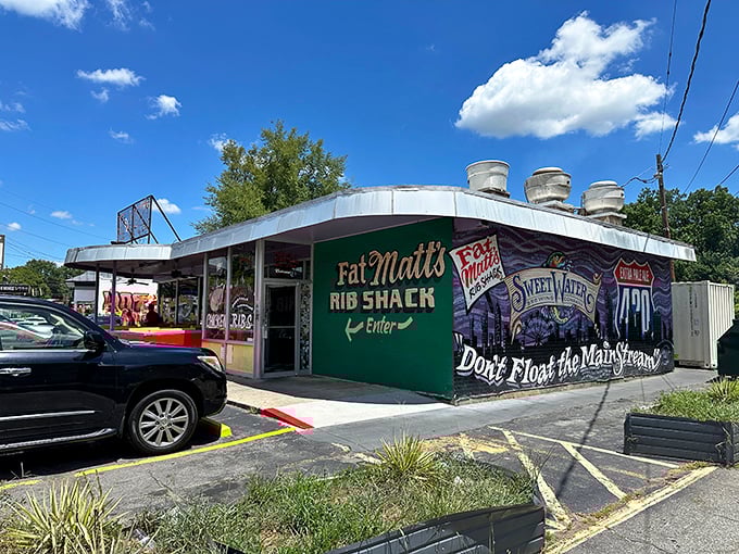 The green wall proudly announces "Rib Shack" like it's the most important job title in Atlanta. And maybe it is!