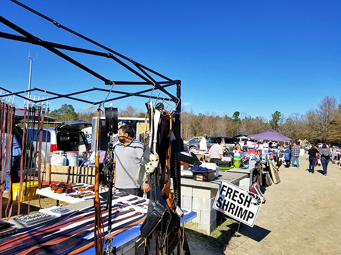 Vendors and shoppers create a bustling marketplace atmosphere at Florence Flea Market.