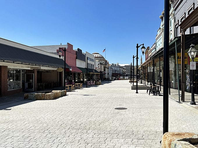 This cobblestone street isn't just quaint—it's practically demanding you slow down and browse those storefronts.