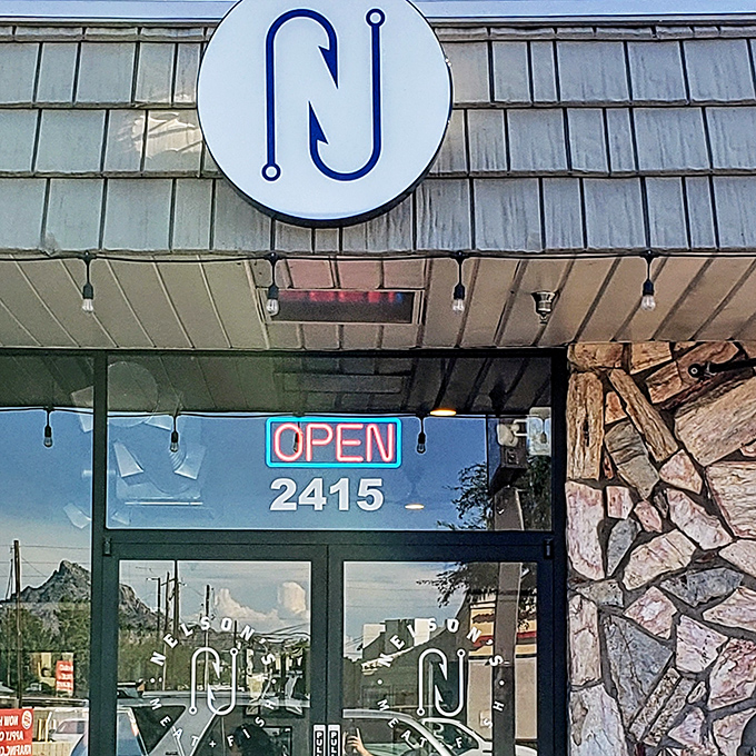 The minimalist hook logo at Nelson's speaks volumes. This isn't just a store—it's a seafood sanctuary for those in the know.