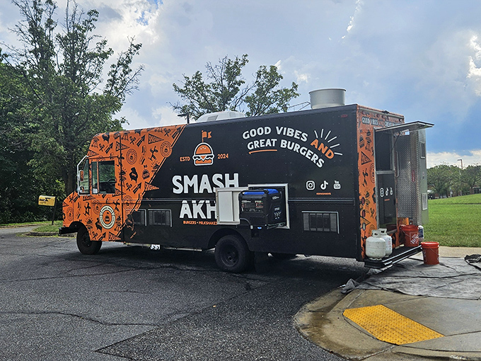 "Good Vibes and Great Burgers" isn't just a slogan—it's a mobile promise wrapped in an eye-catching orange package.