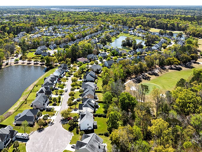 Summerville's aerial view reveals peaceful neighborhoods nestled around ponds—suburban living with a distinctly Southern pace. 