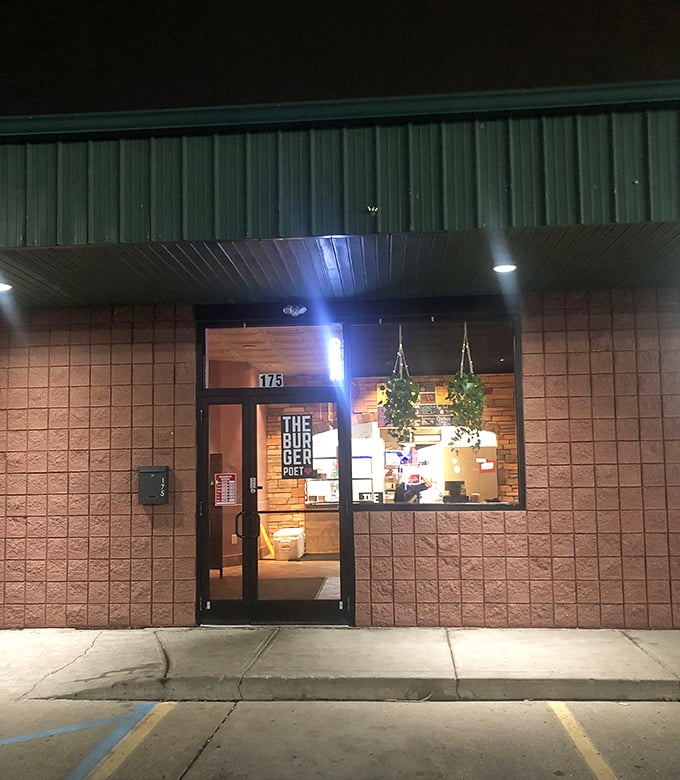 The unassuming entrance hides a cozy burger sanctuary where flavor speaks louder than fancy decor.