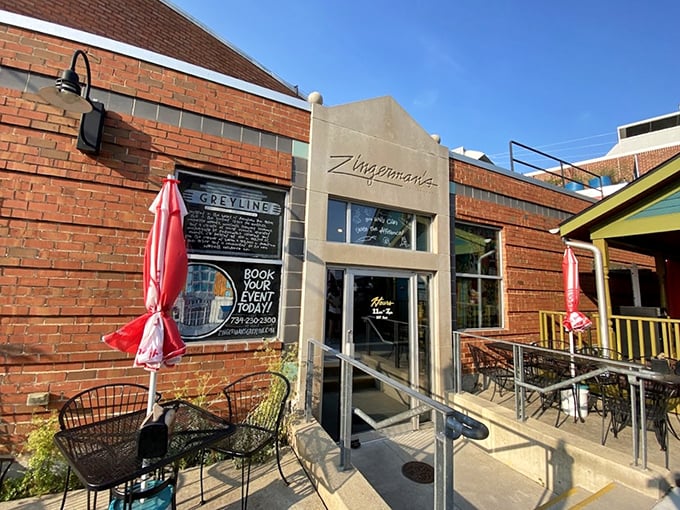 The modern patio entrance to Zingerman's – where sandwich pilgrims gather to worship at the altar of deliciousness.