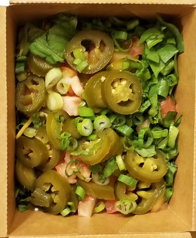 These loaded nachos with jalapeños aren't just a starter—they're a declaration that vegetables can party too when invited to the right BBQ.