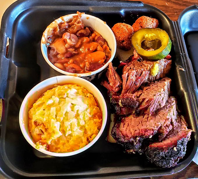 A BBQ platter that answers the eternal question: "Why choose one meat when you can have three?" The mac and cheese isn't just a side—it's a co-star.