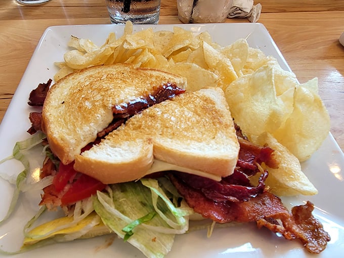 The humble BLT elevated to art form. Perfectly toasted bread, crispy bacon peeking out, and fresh greens – simplicity that somehow manages to be extraordinary.