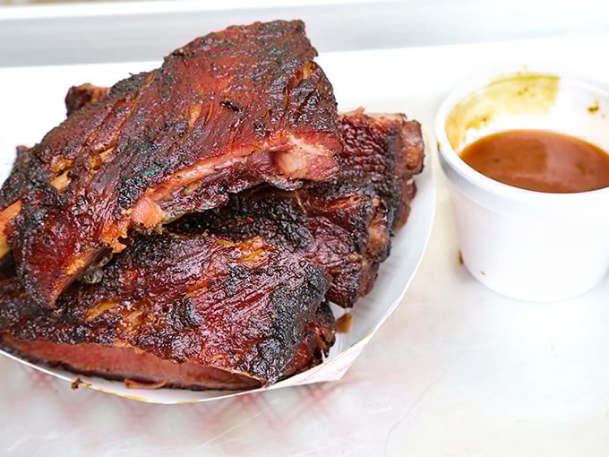 Ribs with a bark so perfect they should be in a barbecue museum—glistening with smoke-infused glory and ready for their close-up.