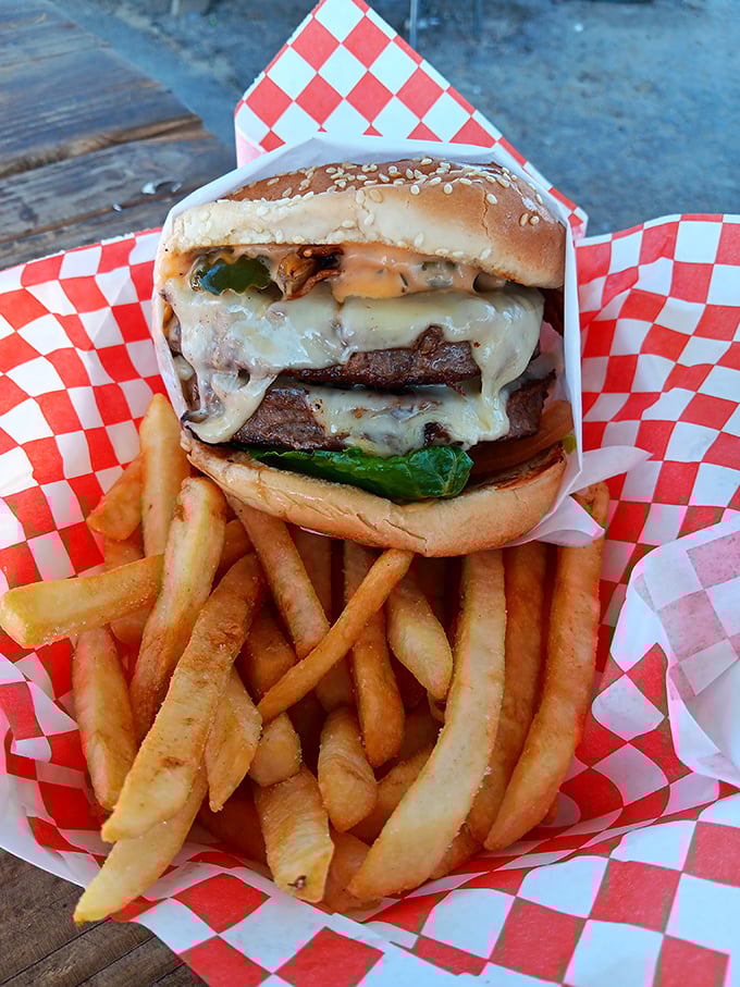 A Swiss cheeseburger that takes both hands and a game plan. This towering masterpiece of beef and melty cheese commands respect—and plenty of napkins.