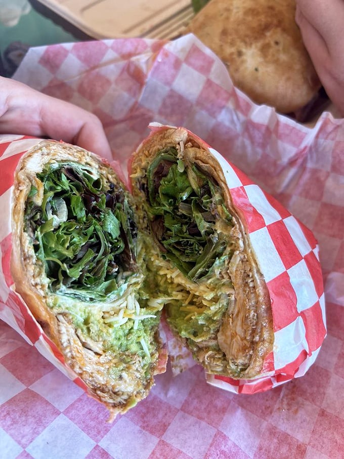 Fresh greens peeking out of a perfectly wrapped tortilla—proof that healthy choices don't have to be boring. This wrap means business.