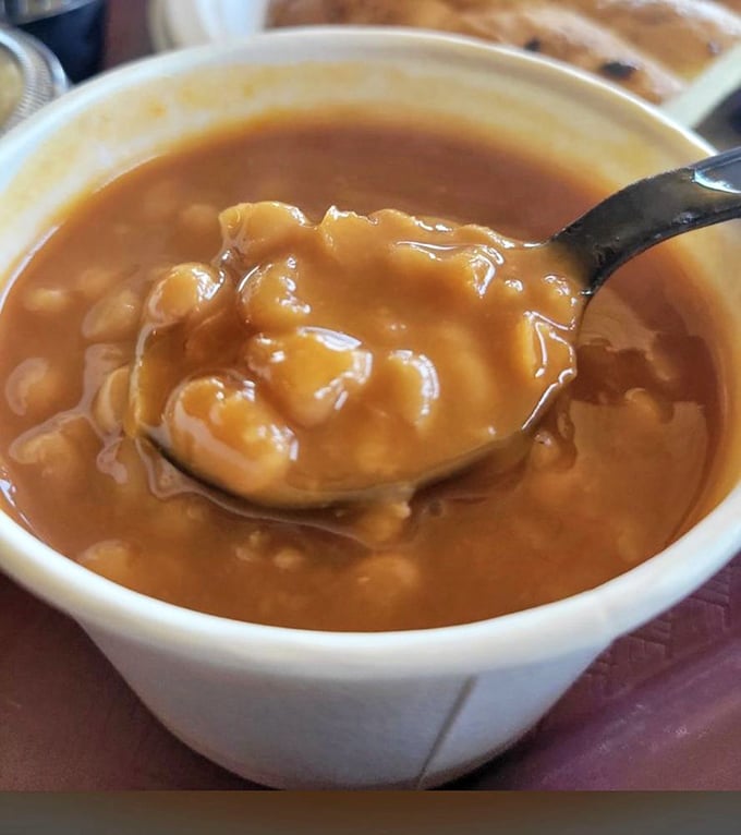These beans have clearly been taking notes during the smoking process – rich, saucy, and studded with enough meat to make vegetarians nervously reconsider.