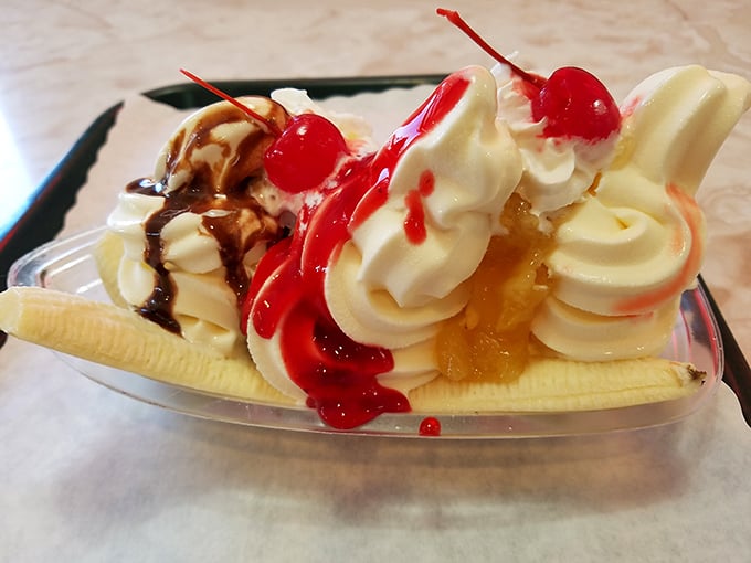 The banana split that time forgot—gloriously excessive, unapologetically sweet, and worth every calorie-laden spoonful.