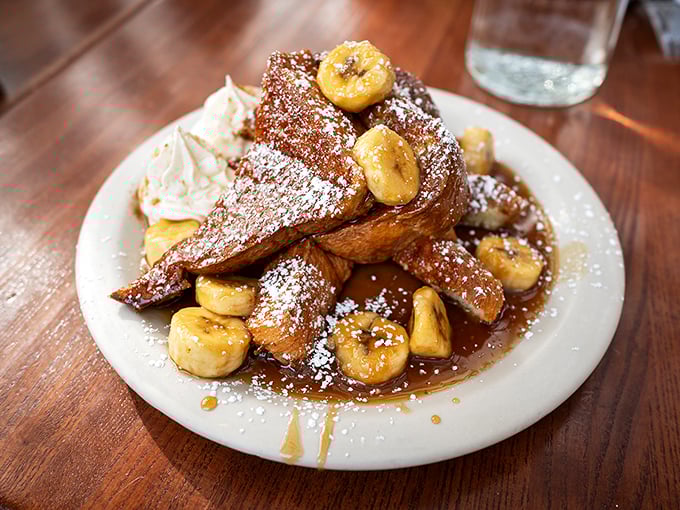 Bananas Foster French toast that's essentially dessert masquerading as breakfast—and nobody's complaining about this delicious identity crisis.
