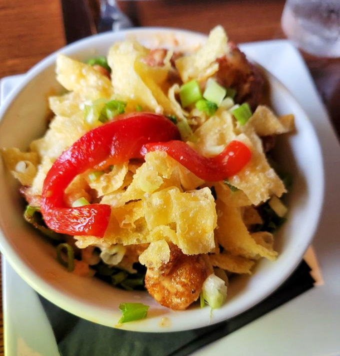 Crispy wonton chips meet tender seafood in this Bang Bang Shrimp that delivers exactly what the name promises—an explosion of flavor.
