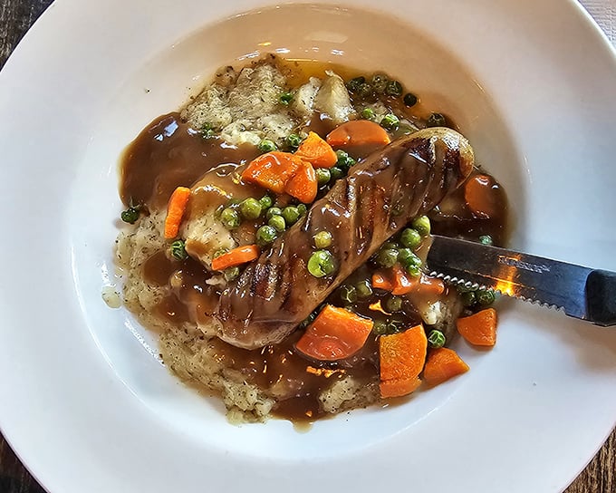 Bangers and mash – where savory sausages lounge on a cloud of potato, swimming in gravy that would make even the Queen request seconds.