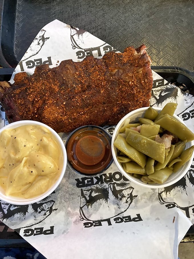 Dry-rubbed ribs with sides of potato salad and green beans—a plate that makes vegetarians question their life choices from across the room.