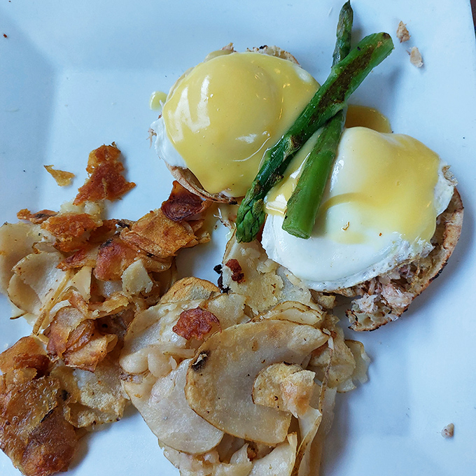 Eggs Benedict with asparagus spears standing at attention – this breakfast knows it's royalty on a plate.