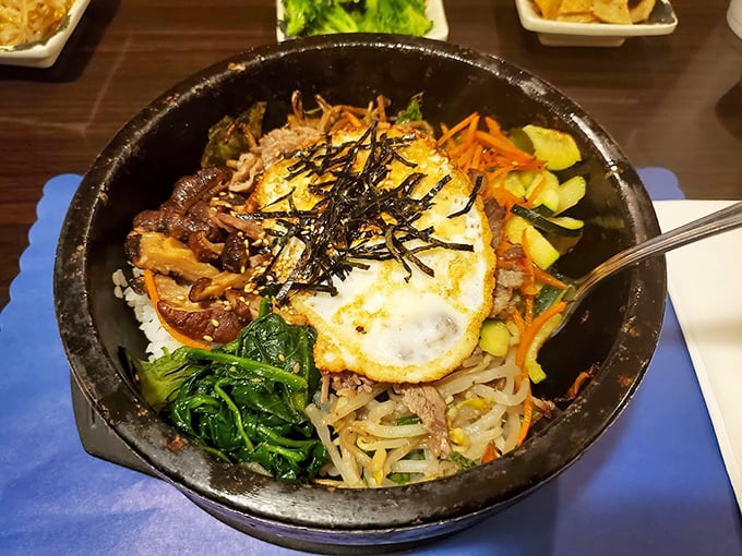 Bibimbap: Korea's answer to "everything but the kitchen sink" – a beautiful chaos of vegetables, meat, rice, and that perfect sunny-side-up egg crown.