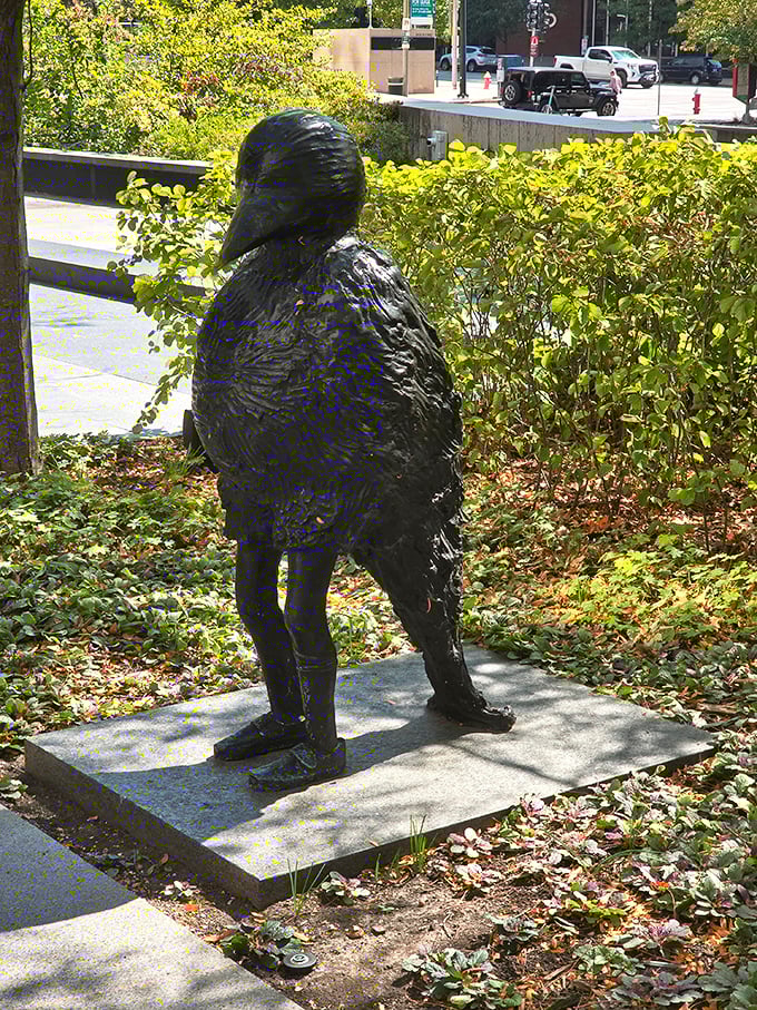 This bird-inspired sculpture seems caught mid-thought, its textured bronze surface inviting curious touches. Urban wildlife of the artistic variety thrives here.