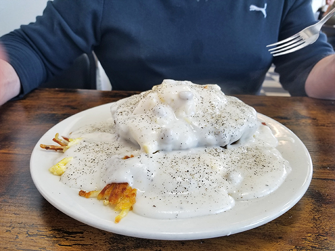 Biscuits and gravy—the breakfast that hugs you from the inside. This plate isn't just food; it's emotional support with pepper.