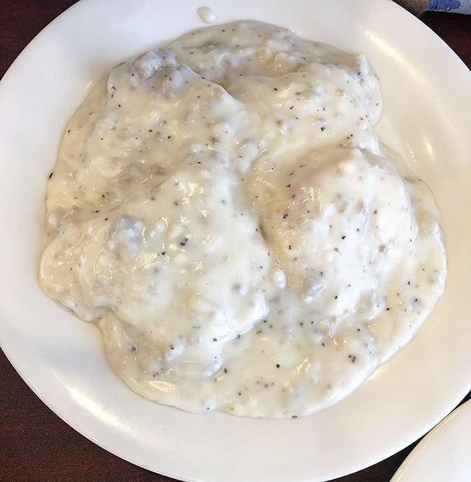 Biscuits and gravy so creamy and peppery they could make a grown Floridian weep with joy. This isn't breakfast—it's an edible hug.