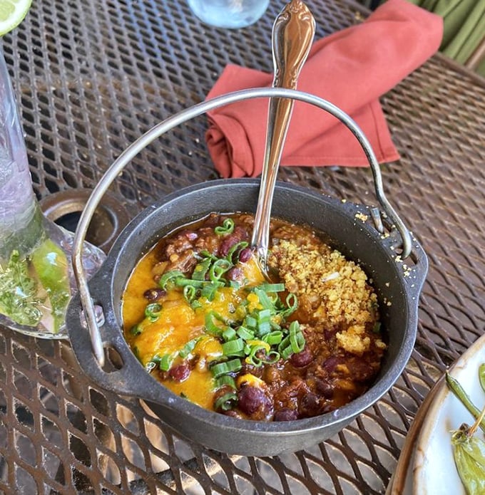 Bison chili served in a mini cast-iron pot—because regular bowls just can't handle this much flavor. Topped with cheese that melts like Arizona sunshine.