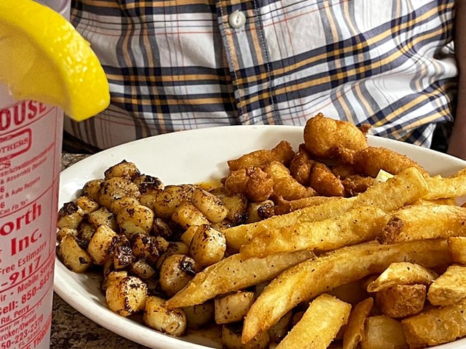 Blackened bay scallops, hushpuppies, and fries—the holy trinity of Florida seafood dining that makes you wonder why anyone bothers with fancy restaurants.