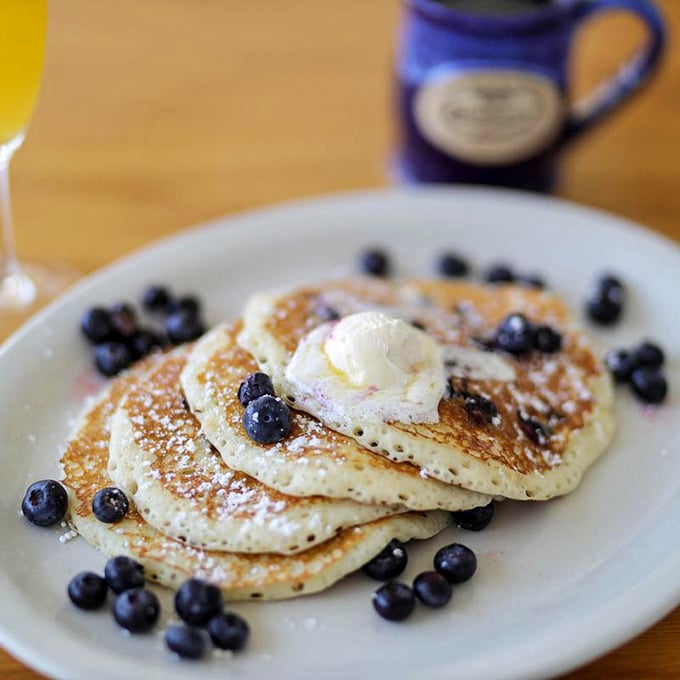 Blueberry pancakes that actually taste like blueberries—revolutionary concept! The melting butter is just showing off at this point.