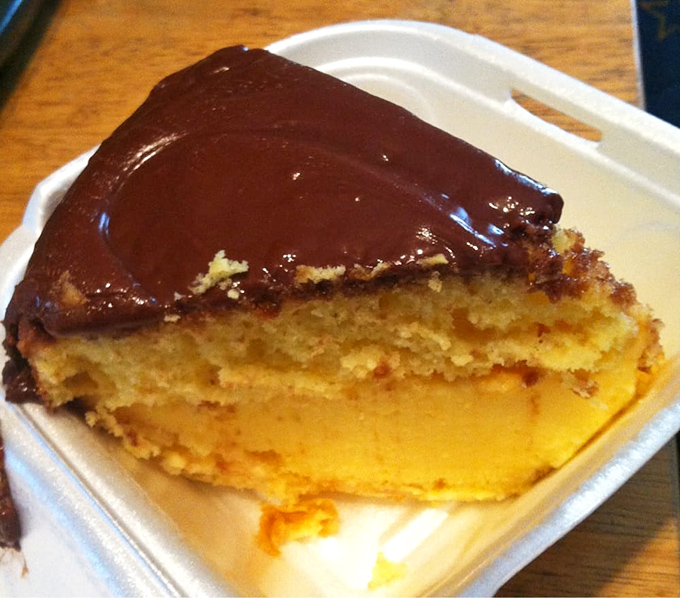 That Boston cream pie slice looks like it could solve all of life's problems, one bite at a time.