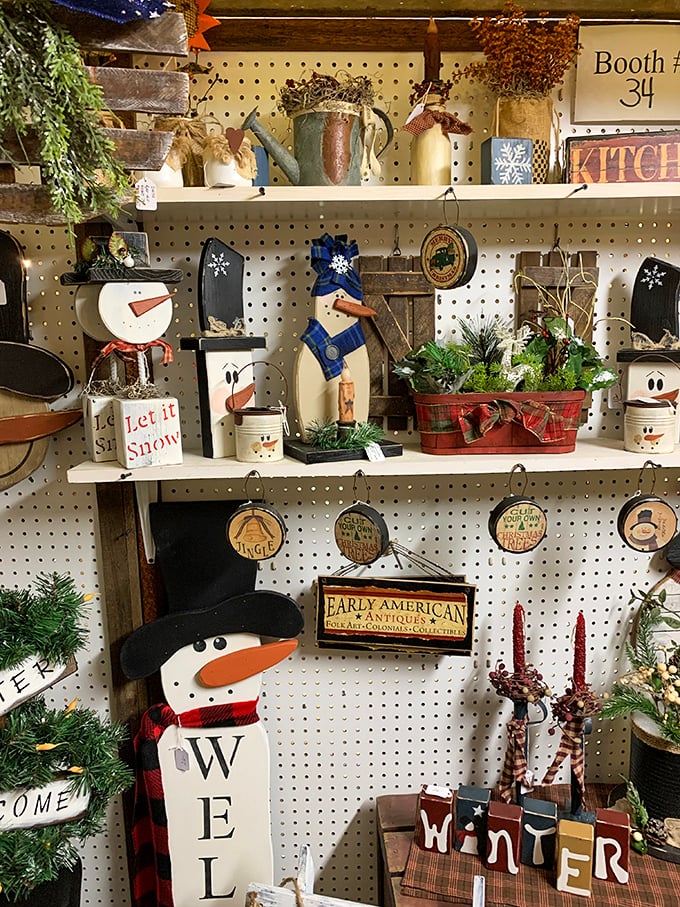 Booth 34's winter wonderland proves that snowmen are the zombies of decorations—they never truly die, they just hibernate until the next seasonal resurrection.