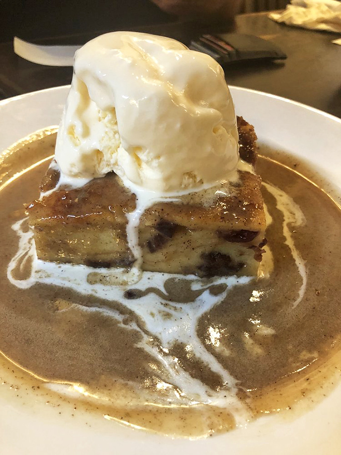 Bread pudding that would make your grandmother both jealous and proud, crowned with ice cream melting into a pool of caramel bliss.