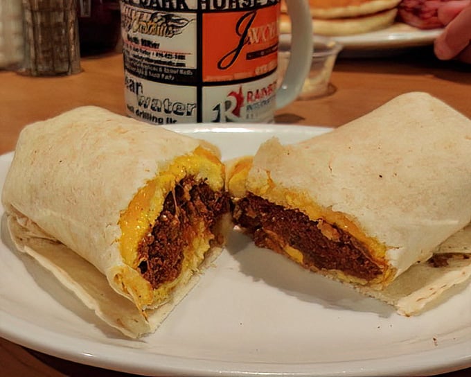 The legendary breakfast burrito, cut to reveal its treasure trove of fillings—like a delicious archaeological dig revealing ancient secrets of flavor.